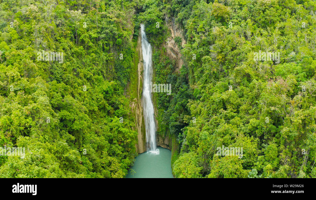 Beautiful waterfall in green forest, top view. Tropical Mantayupan ...