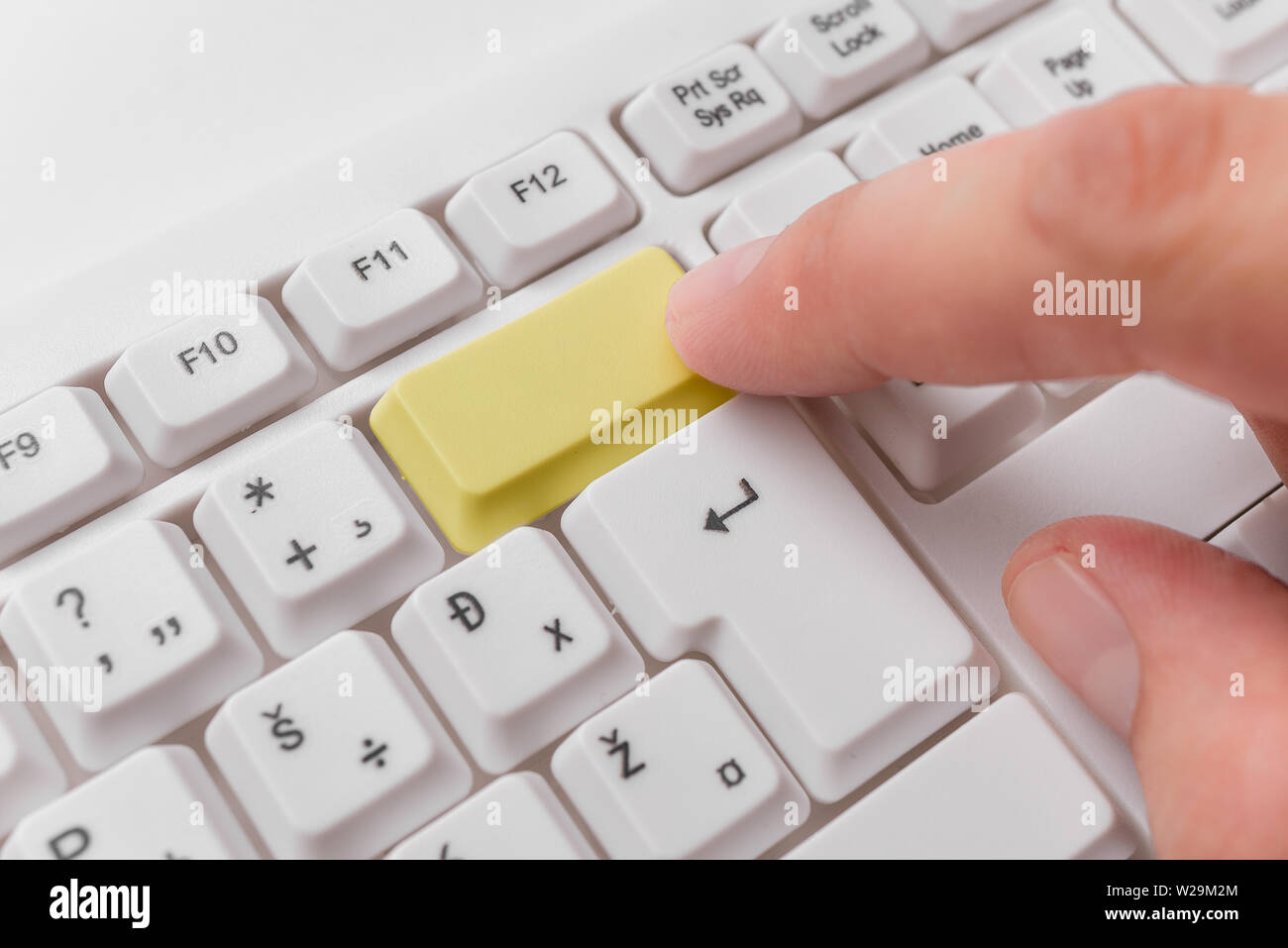 White pc keyboard with empty note paper above white background key copy ...