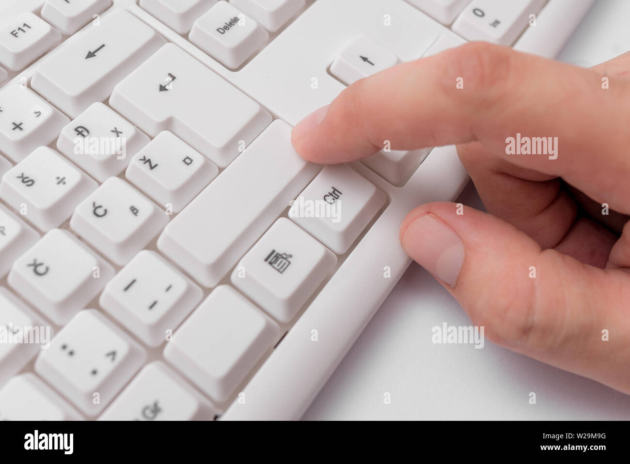 White pc keyboard with empty note paper above white background key copy ...