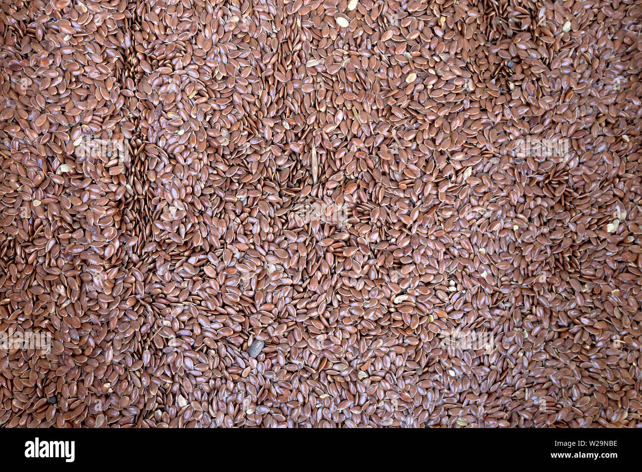 Flaxseed background. A background of dried flaxseeds Stock Photo - Alamy