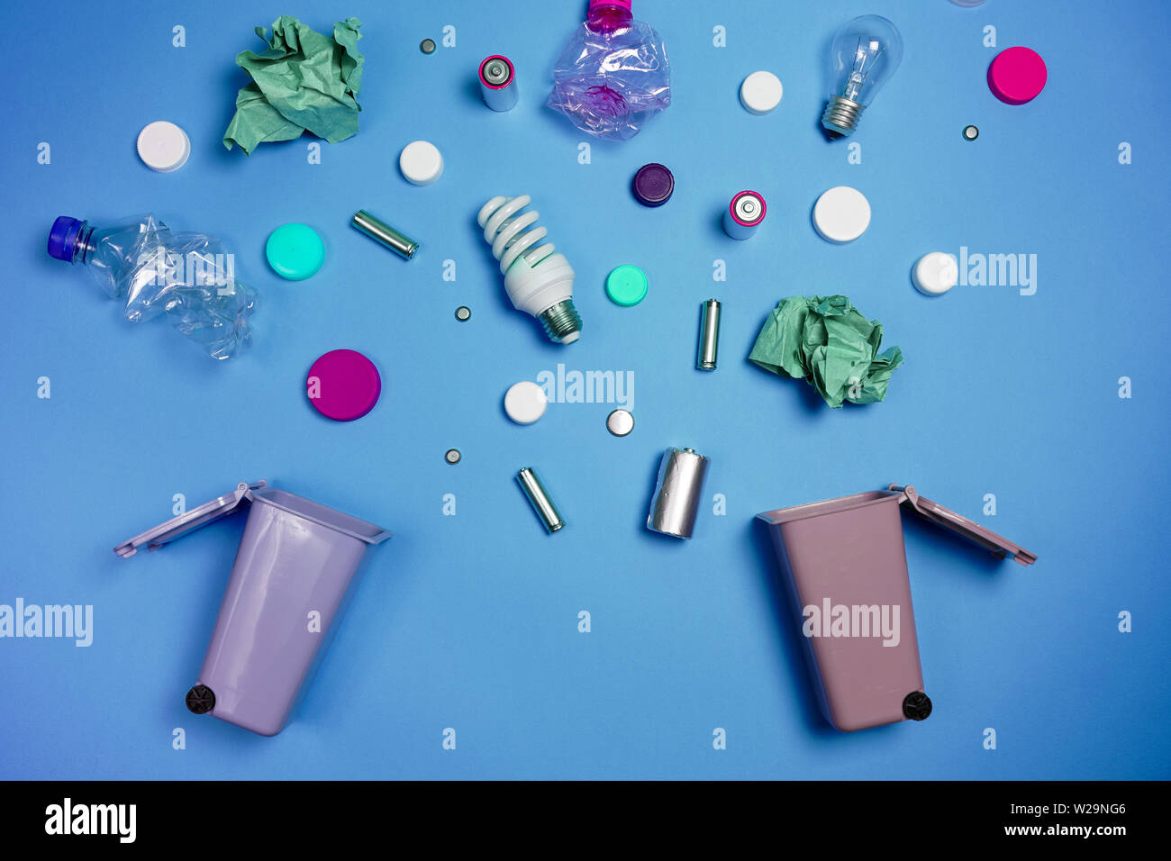 Trash bins and assorted garbage isolated on green, recycle concept, Top ...