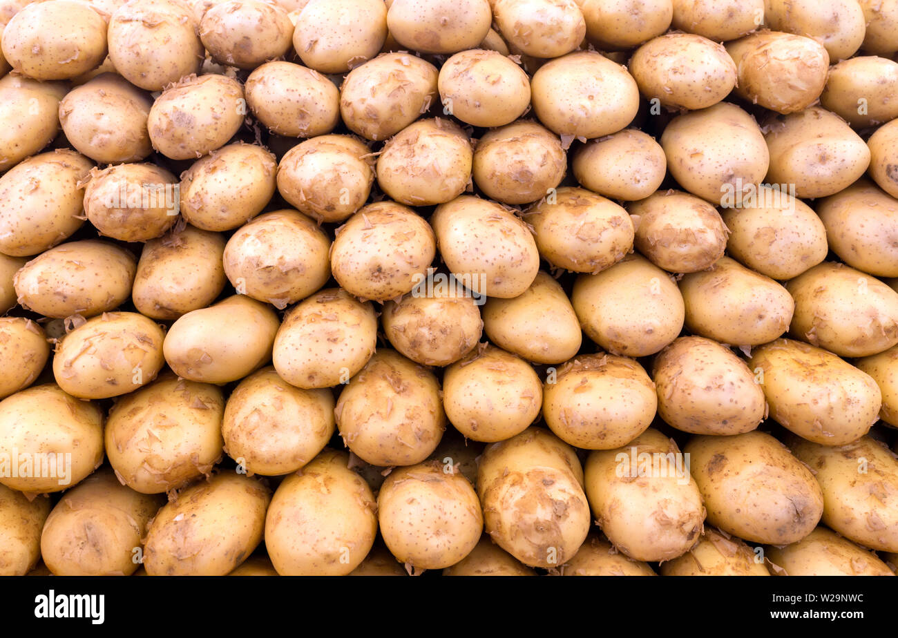 Fresh potatoes, background Stock Photo - Alamy