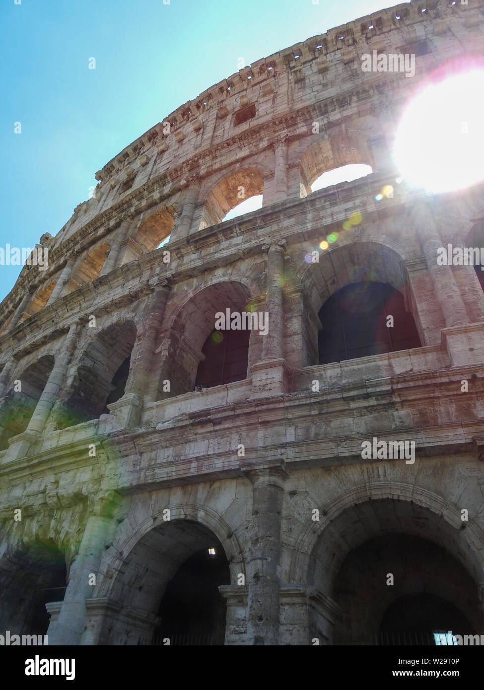 Colosseum, Rome, Italy with sun flare Stock Photo - Alamy