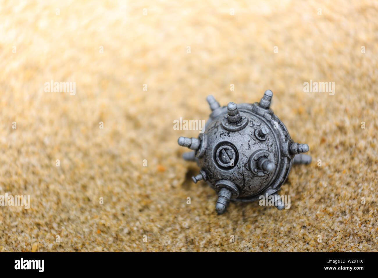 silver color plastic mine toy on the sands Stock Photo - Alamy