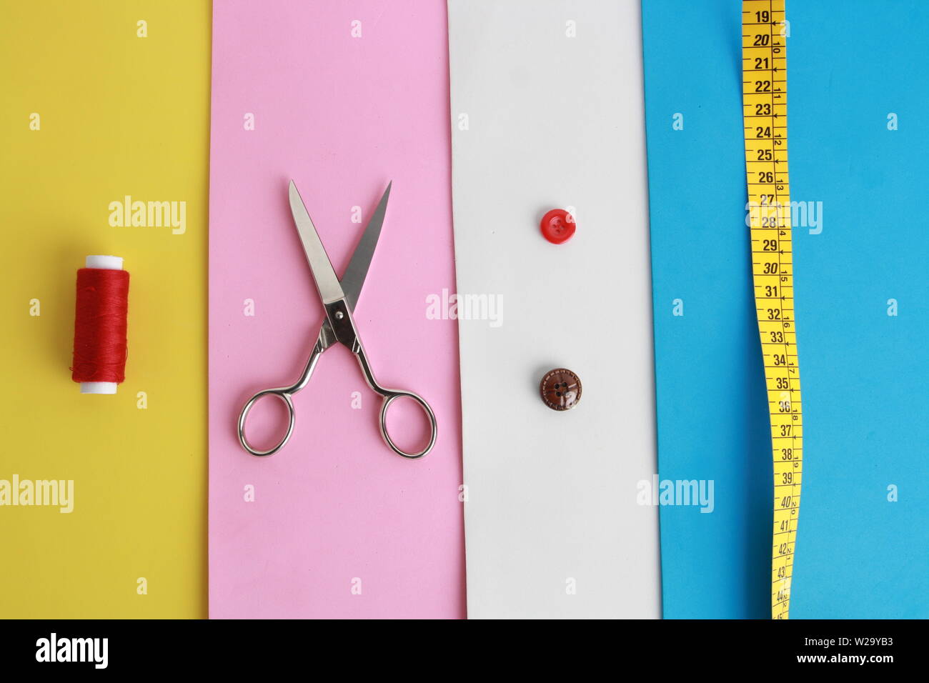 sewing objects on colorful background Stock Photo - Alamy