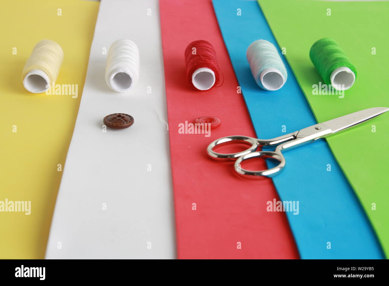 sewing objects on colorful background Stock Photo - Alamy
