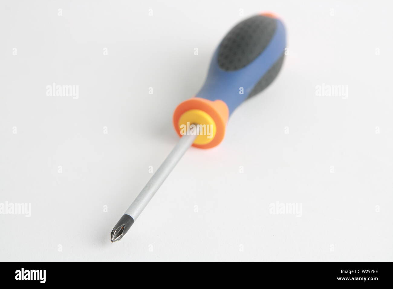 screwdriver tipped star, orange blue and black Stock Photo - Alamy