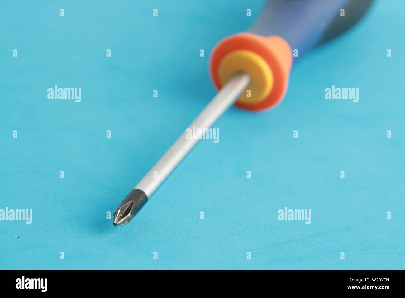 screwdriver tipped star, orange blue and black Stock Photo - Alamy