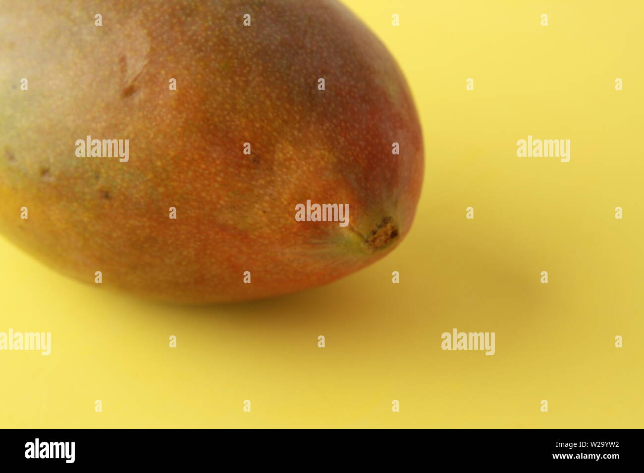 Delicious mango in colorful background Stock Photo - Alamy