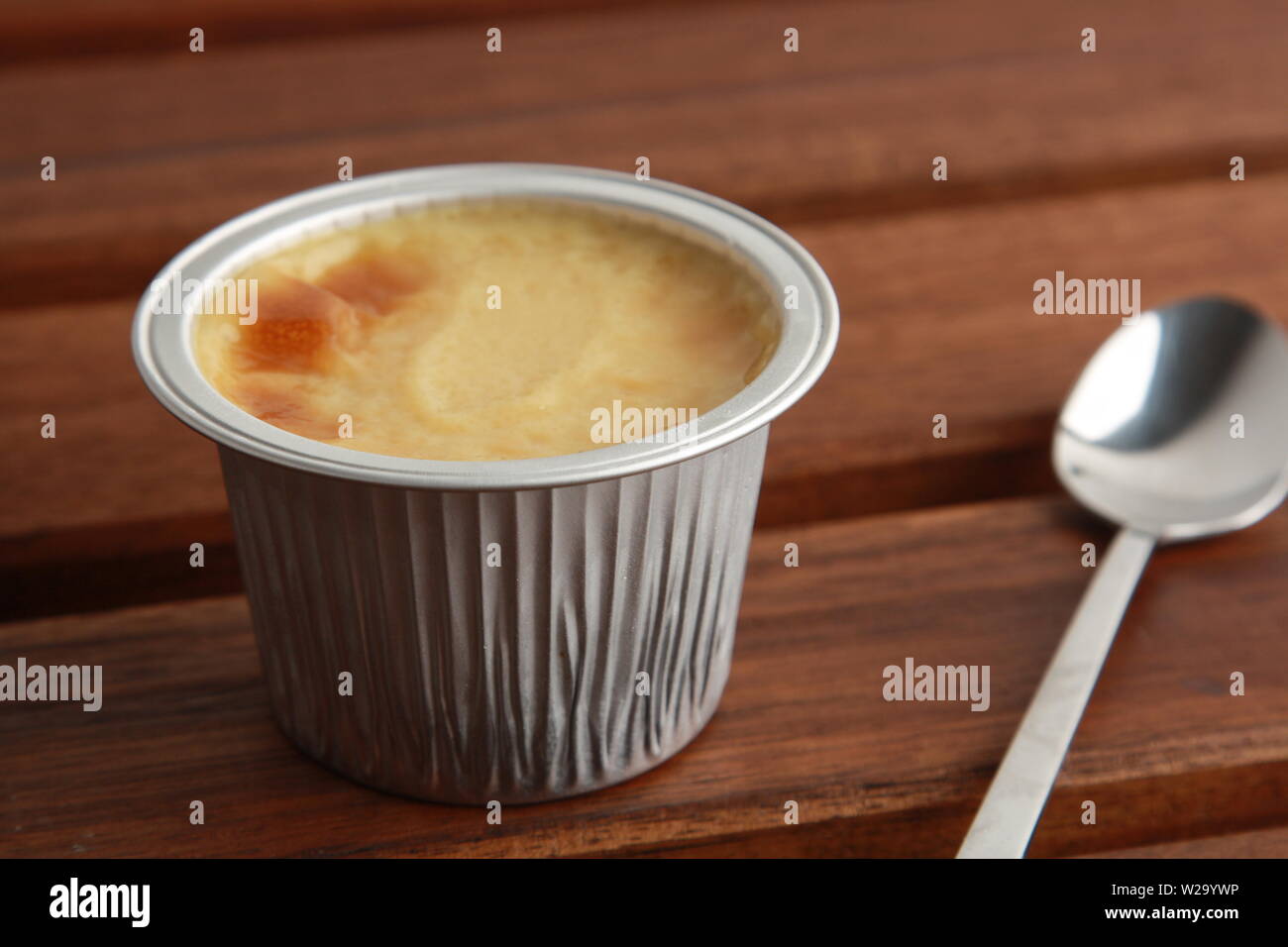 delicious egg flan in aluminum container Stock Photo - Alamy
