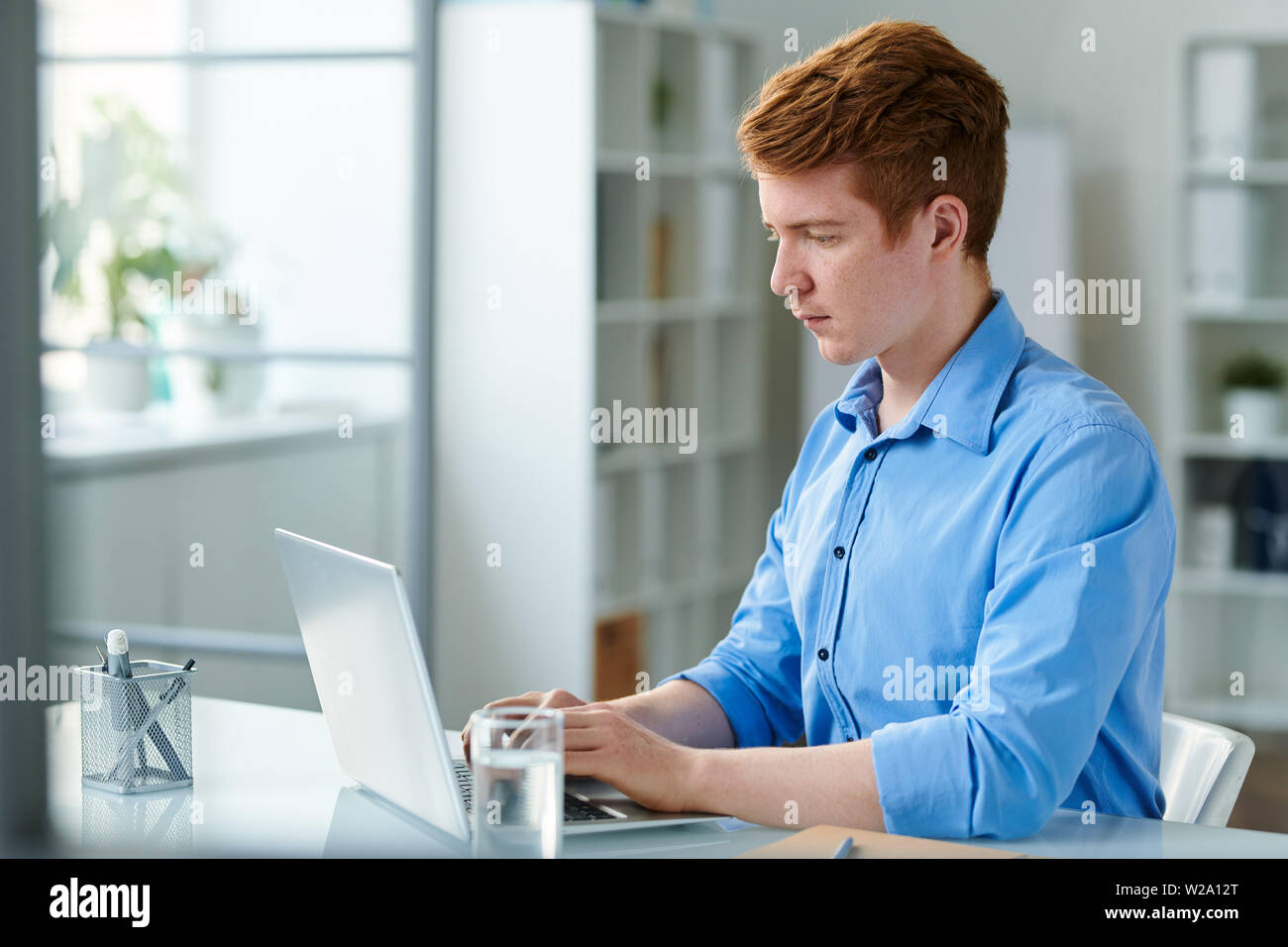 Young confident man typing hi-res stock photography and images - Alamy