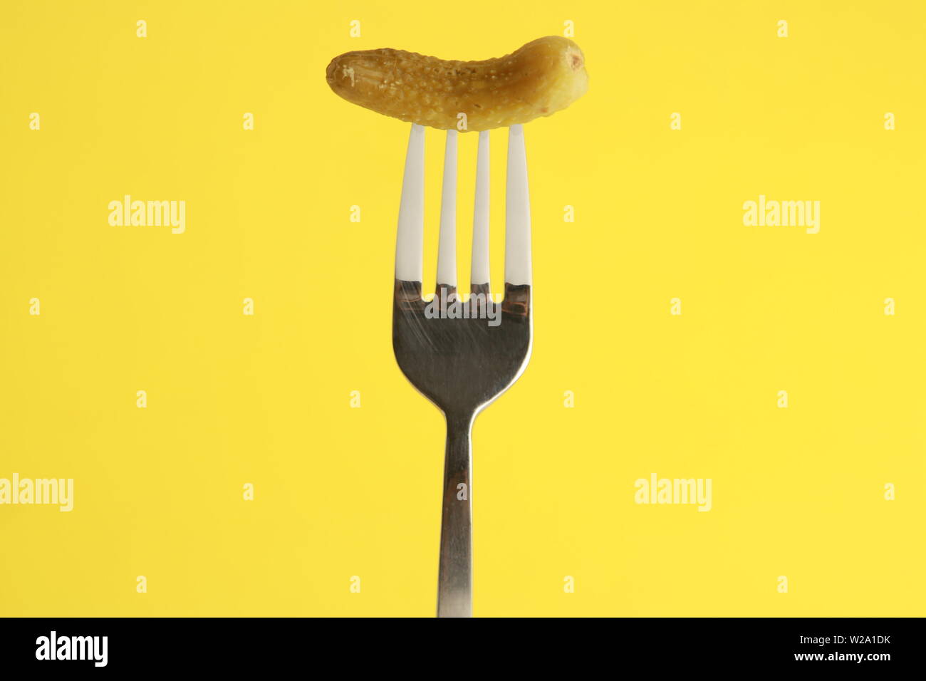 delicious gherkin in colorful background Stock Photo - Alamy