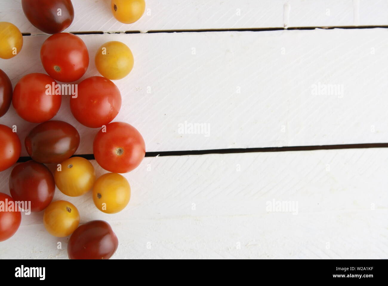 Three varieties of cherry tomatoes Stock Photo - Alamy