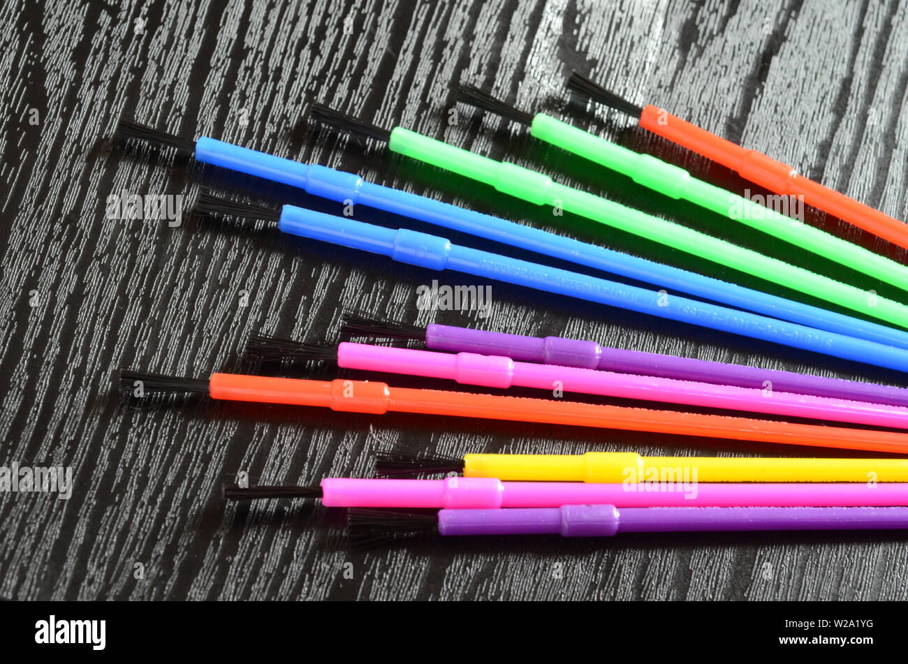 COLORING BOOK A rainbow colored assortment of paint brushes Stock Photo ...