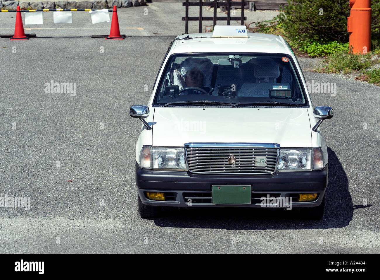 White Retro Japanese Taxi Car In Tokyo. Taxi Driver Are Is Waiting For ...
