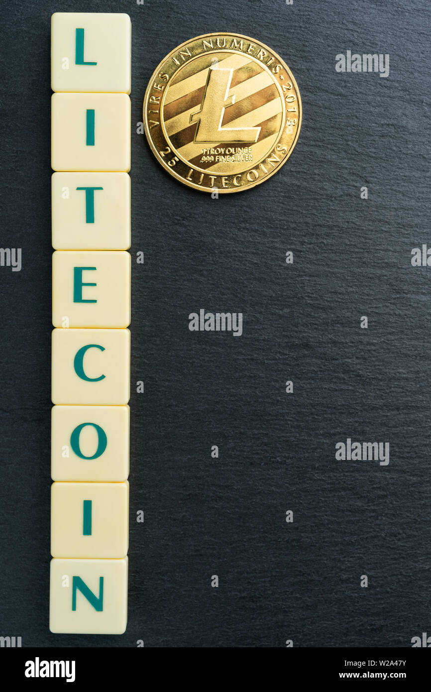 Physical Litecoin gold coin with text made out of letter tiles ...