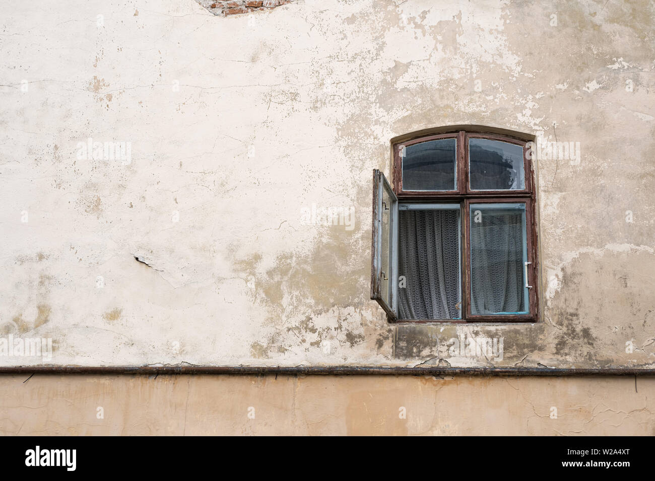 Old grungy open window on neglected wall. Copy space on the left Stock ...
