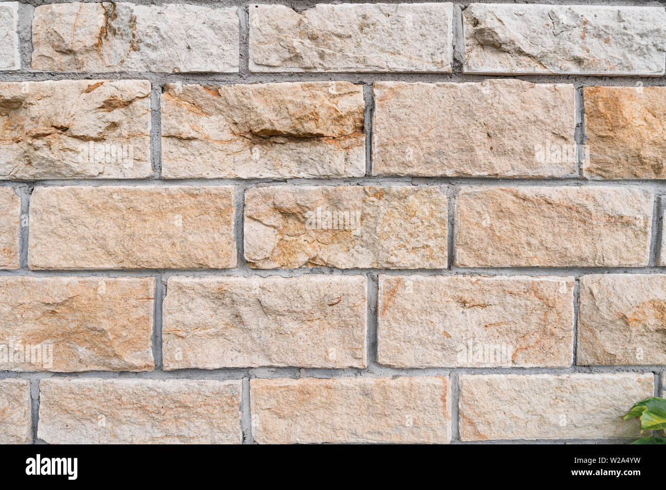 Light stone tiles wall as a background Stock Photo - Alamy