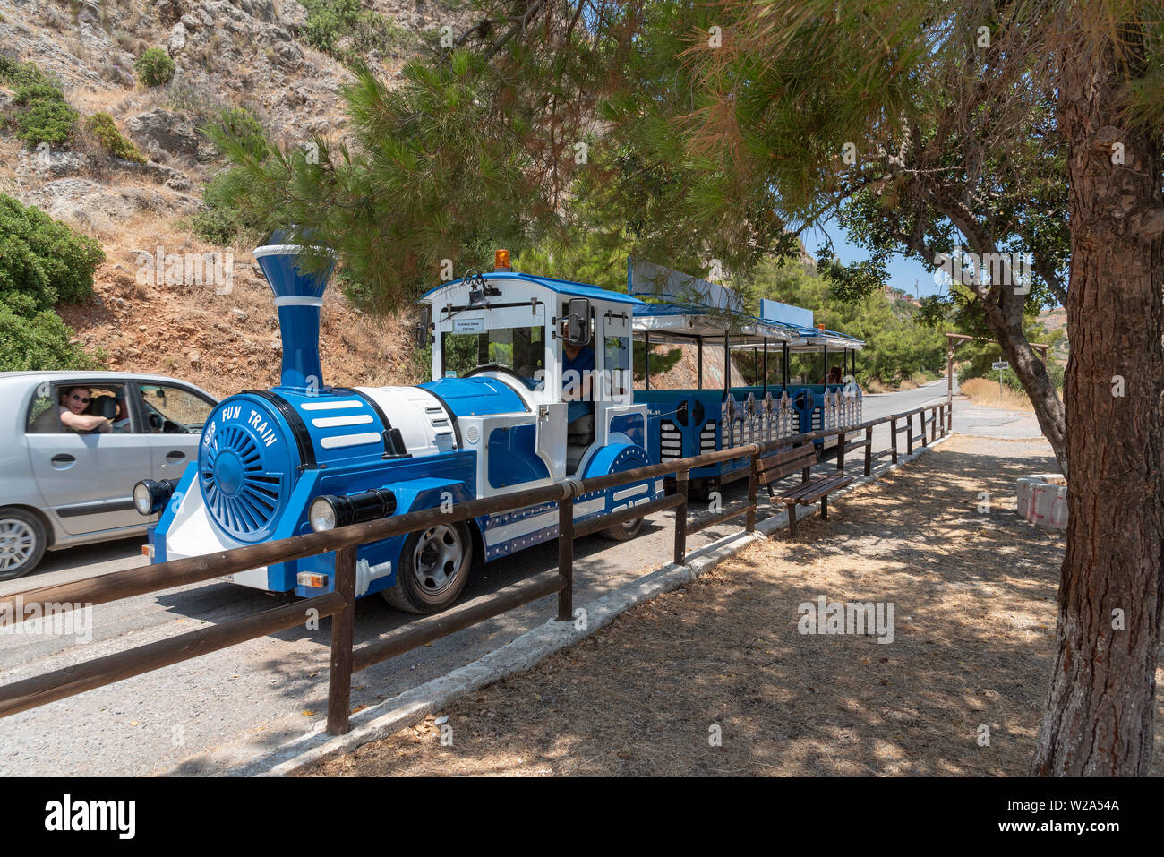 Crete, Greece. June 2019. A tourist road train on a route passing ...