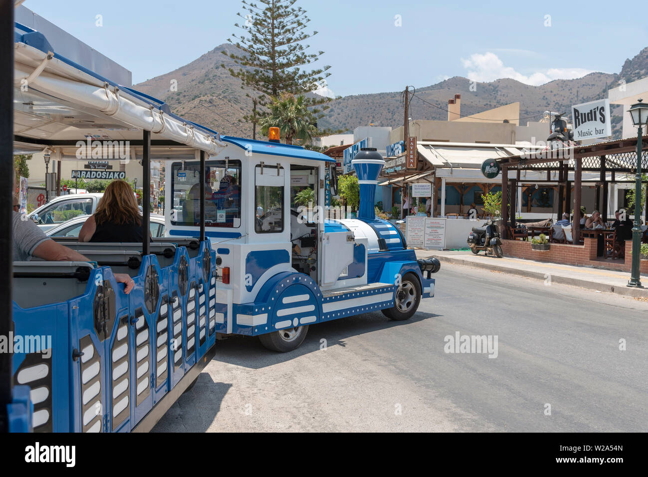 Crete, Greece. June 2019. A tourist road train on a route leaving ...