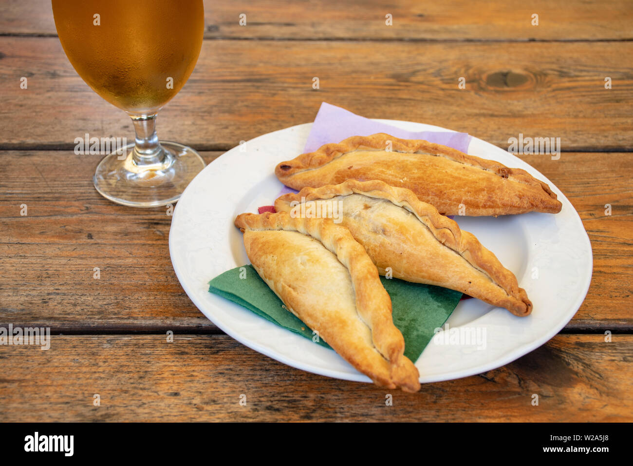 Kibinai with cold beer, traditional Lithuanian food, pastries filled ...