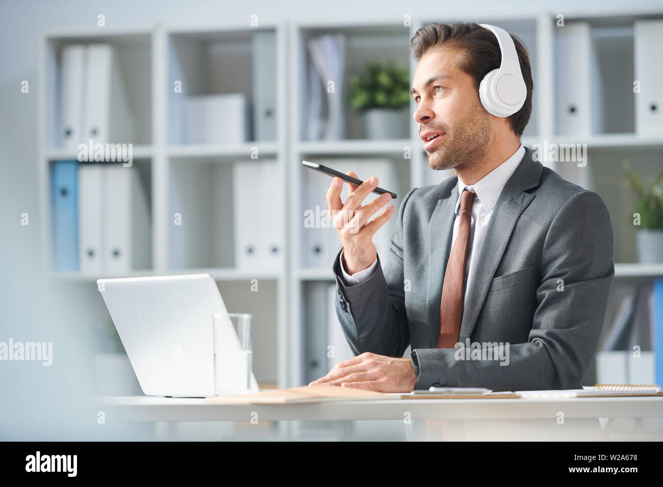 Business man headphones suit working hi-res stock photography and ...