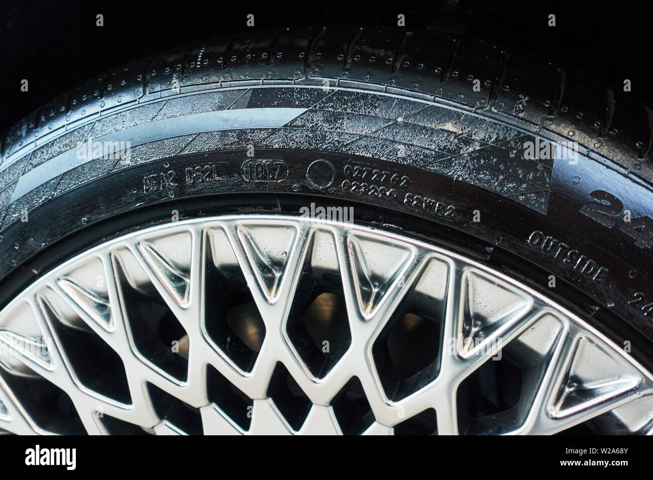 Wheel of a modern car with part of rim and tyre Stock Photo - Alamy
