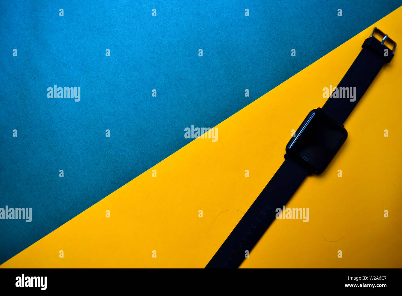 Smart watch on top view color table background Stock Photo - Alamy