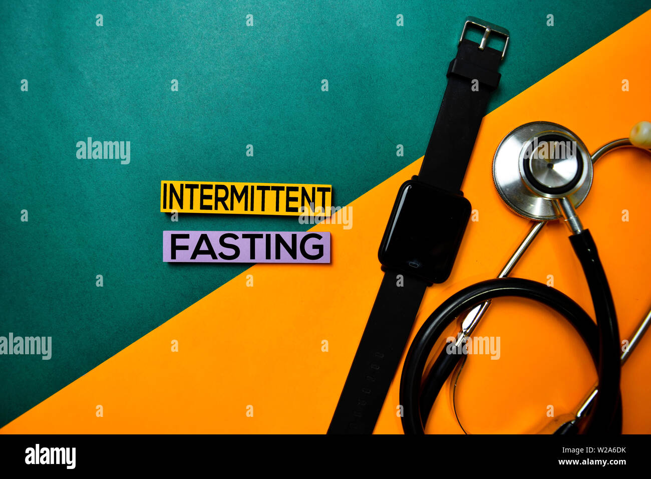Intermittent Fasting text on top view color table and Healthcare ...