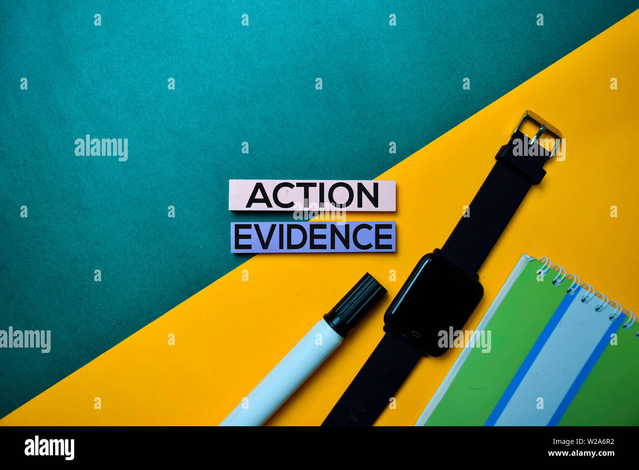 Action Evidence text on top view color table background Stock Photo - Alamy