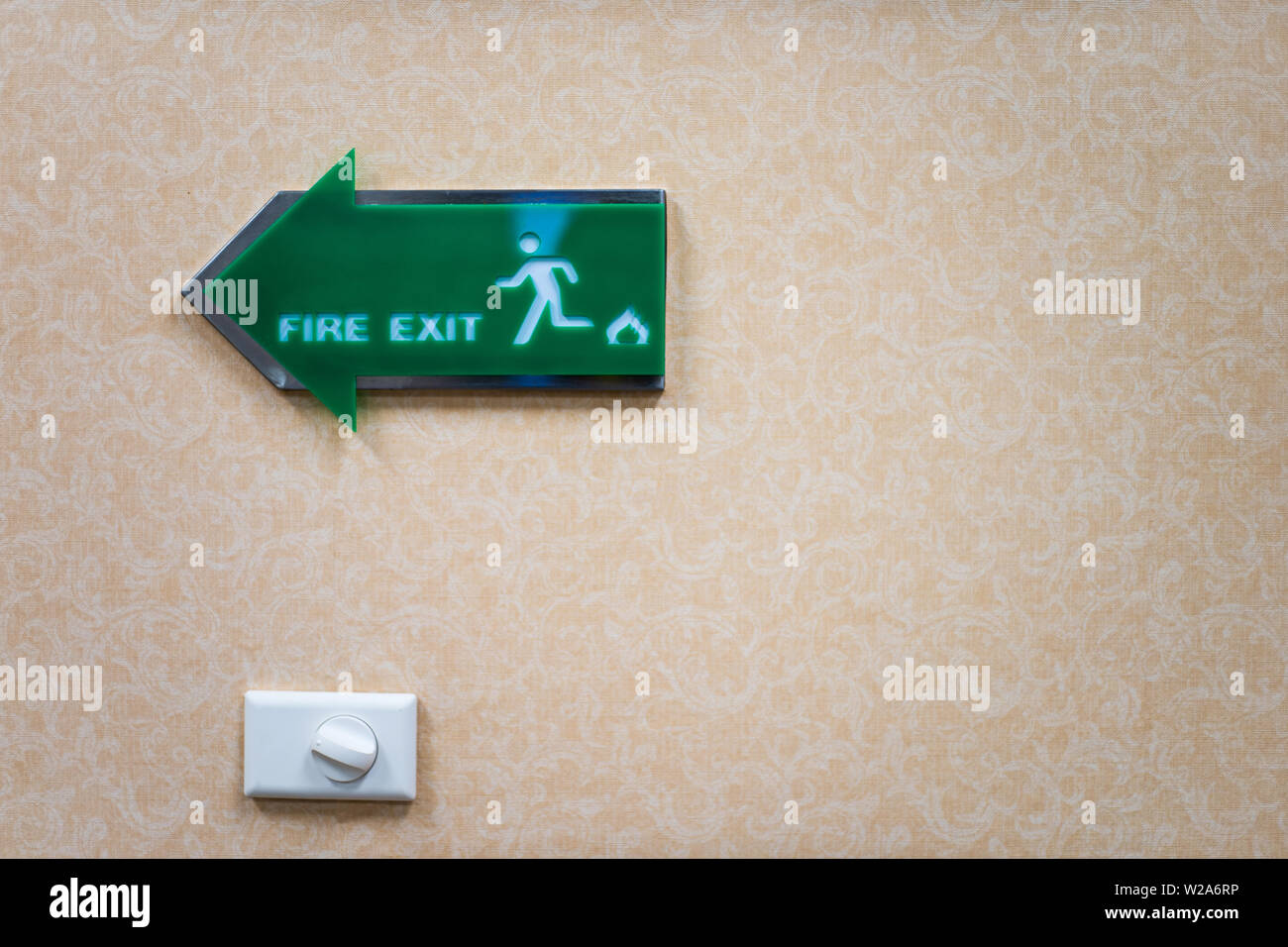 Fire exit sign on wall, fire escape standard sign in building Stock ...
