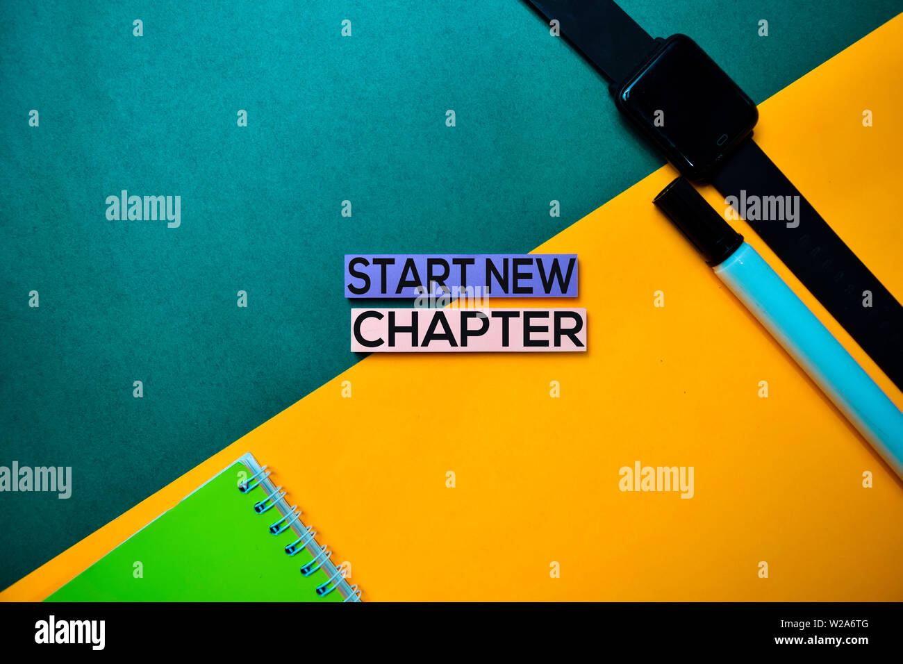 Start New Chapter text on top view color table background Stock Photo ...