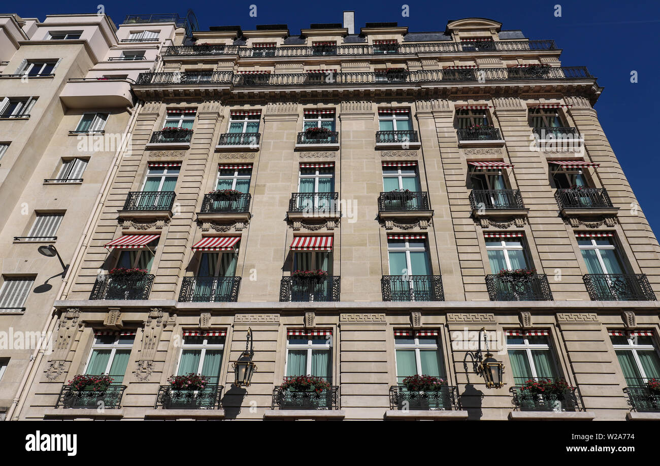 Traditional French house with typical balconies and windows. Paris ...