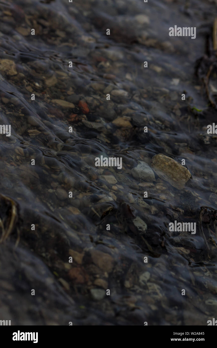 mud in the rain creating mini waterfall and river Stock Photo - Alamy