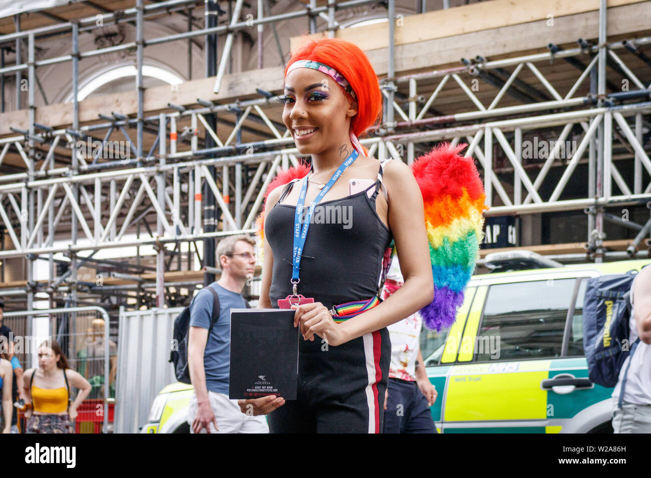 A woman dressed as an angel, with rainbow colours during the parade.The ...