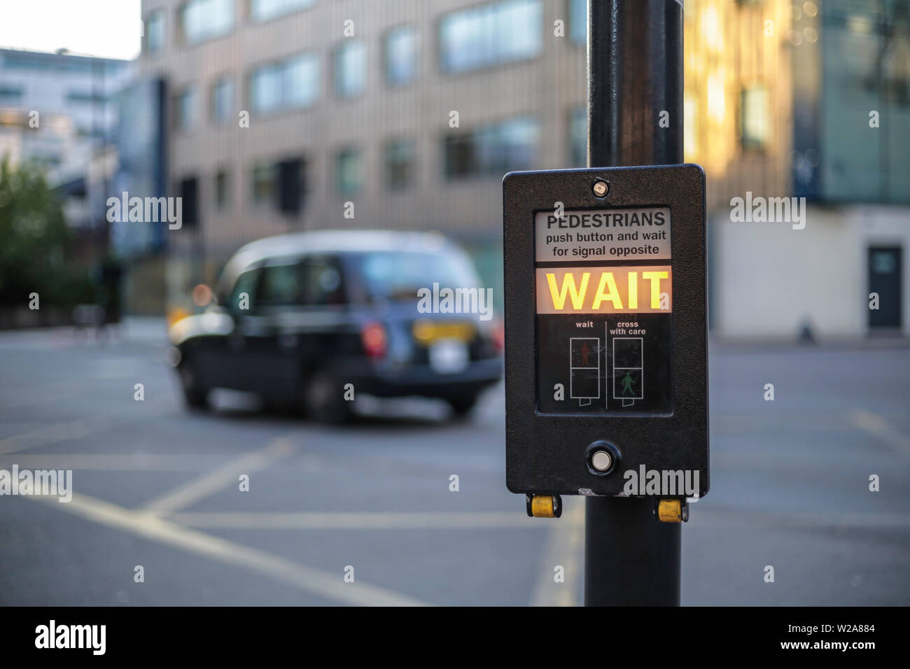 London cross lights with crossing light "Wait" sign Stock Photo - Alamy