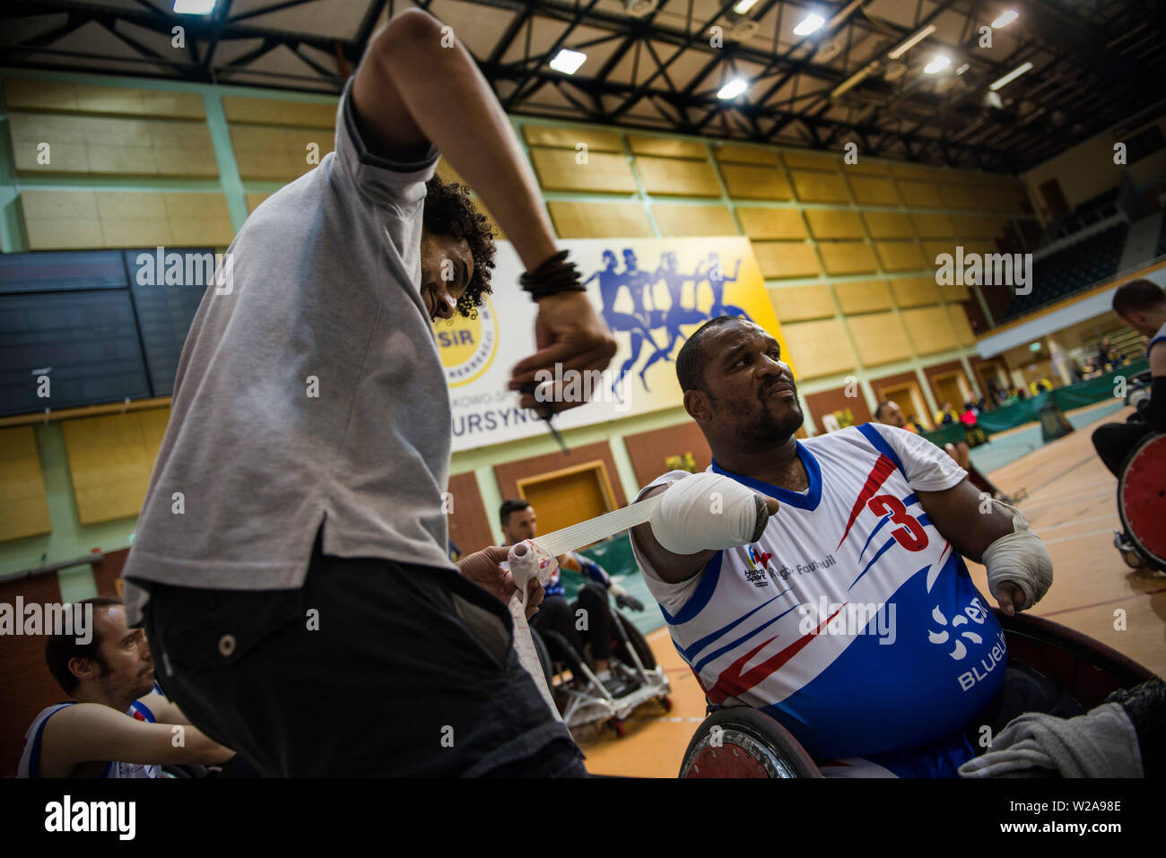 A French player being treated with medical help during the final game ...