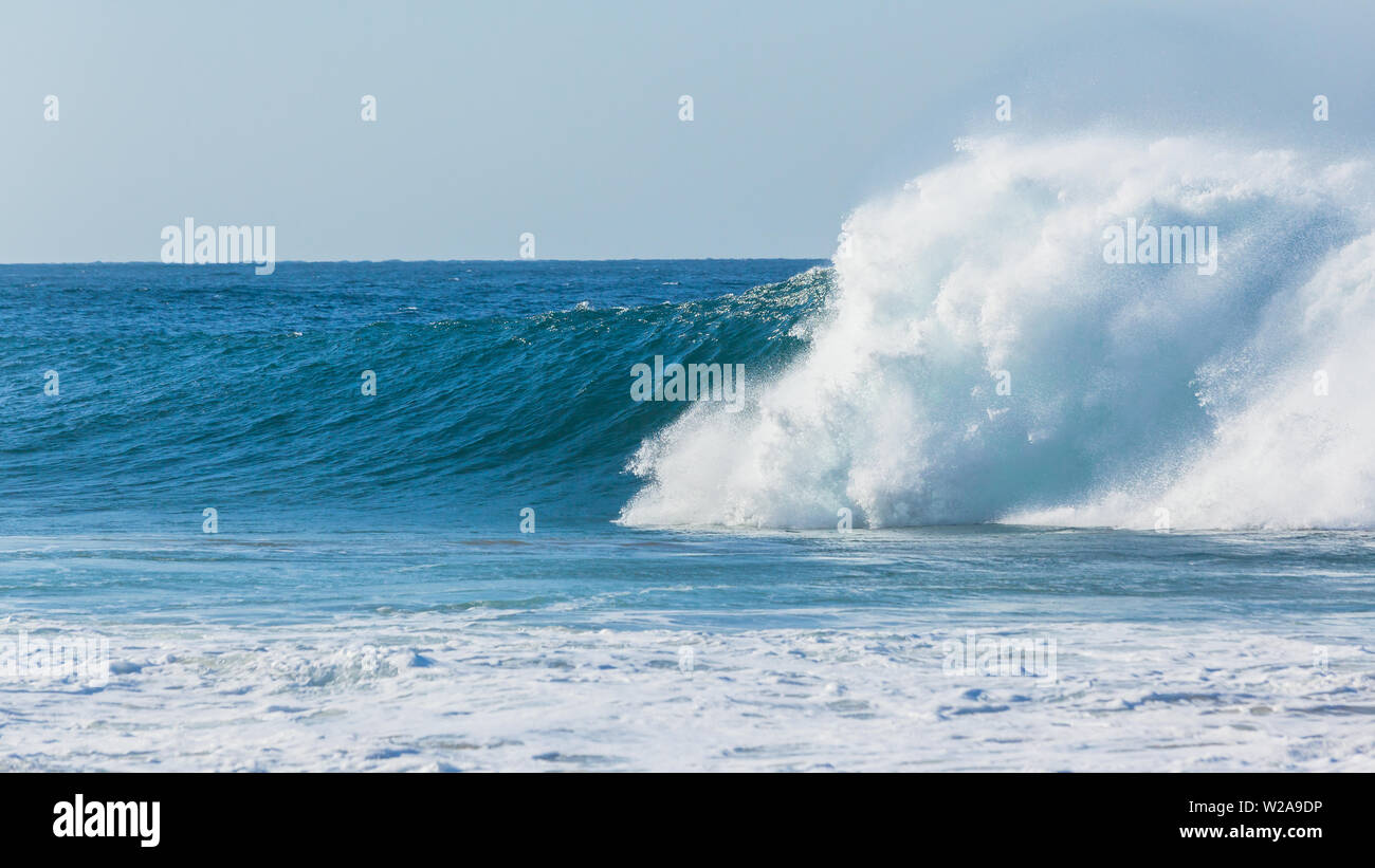 Ocean wave crashing blue exploding white water Stock Photo - Alamy