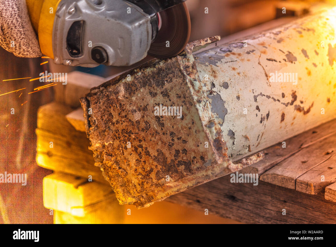 Sparks flying over the working during metal grinding Stock Photo - Alamy