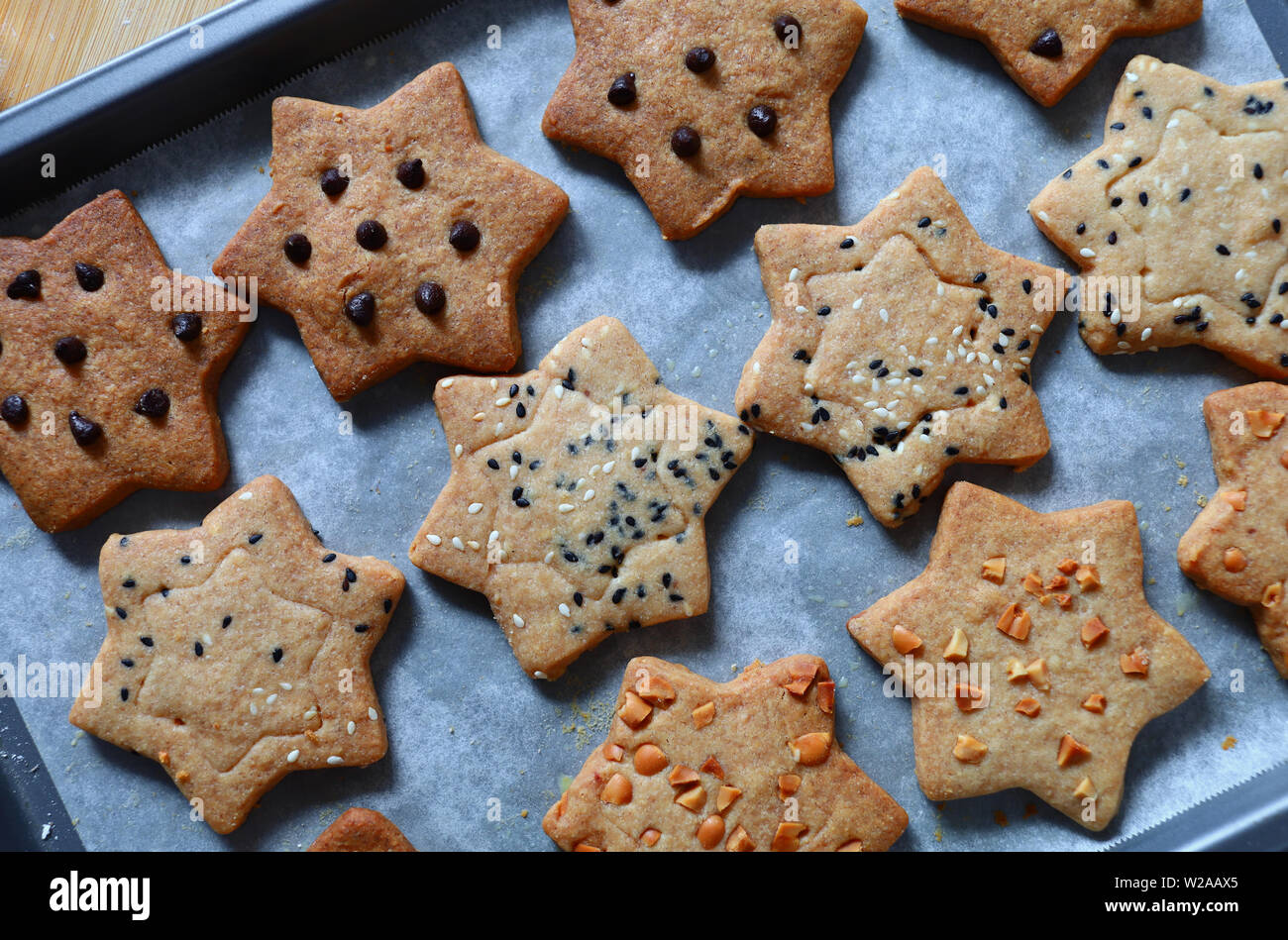 Homemade star shape cookies on baking tray Stock Photo - Alamy