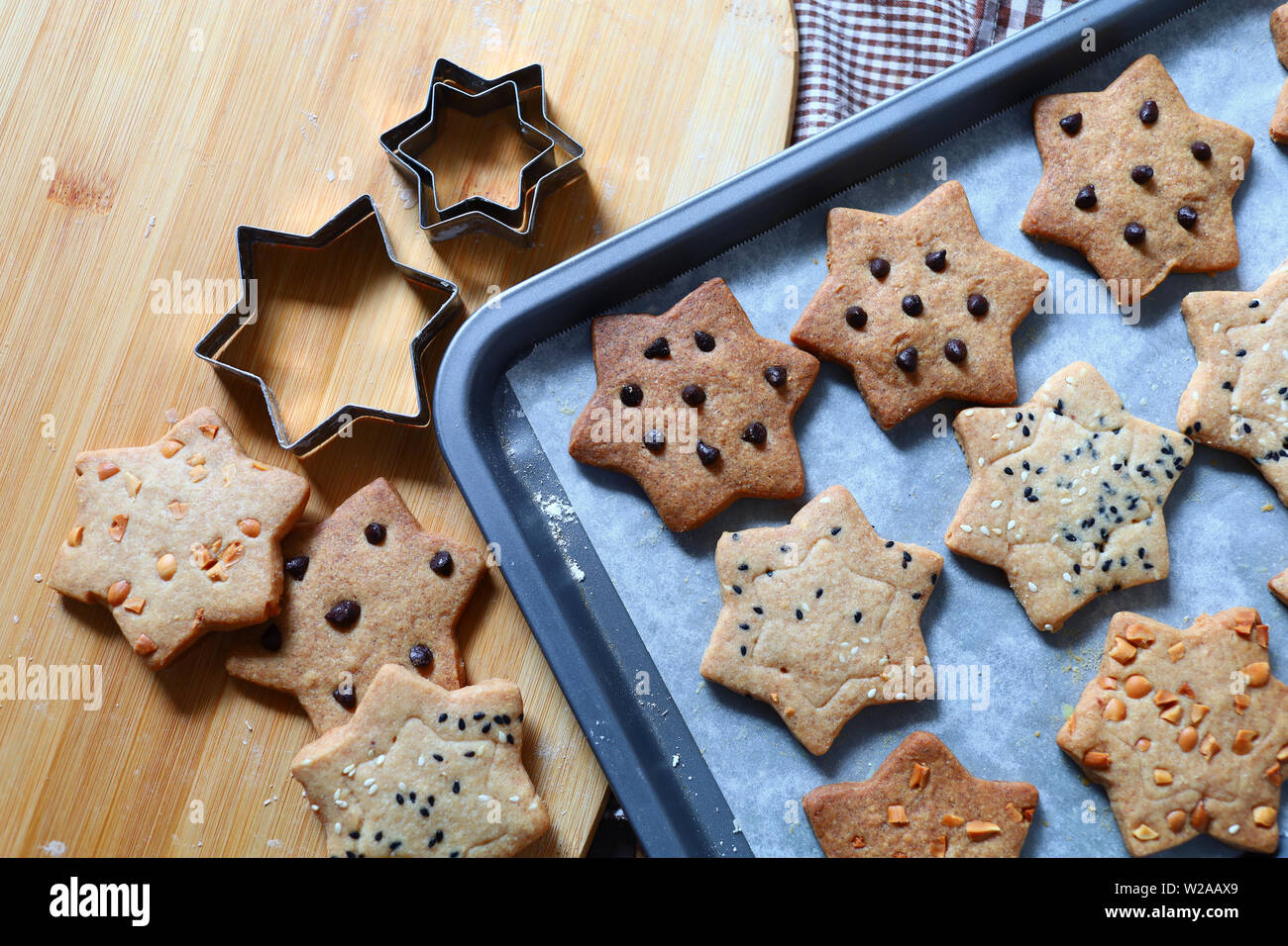 Homemade star shape cookies on baking tray Stock Photo - Alamy