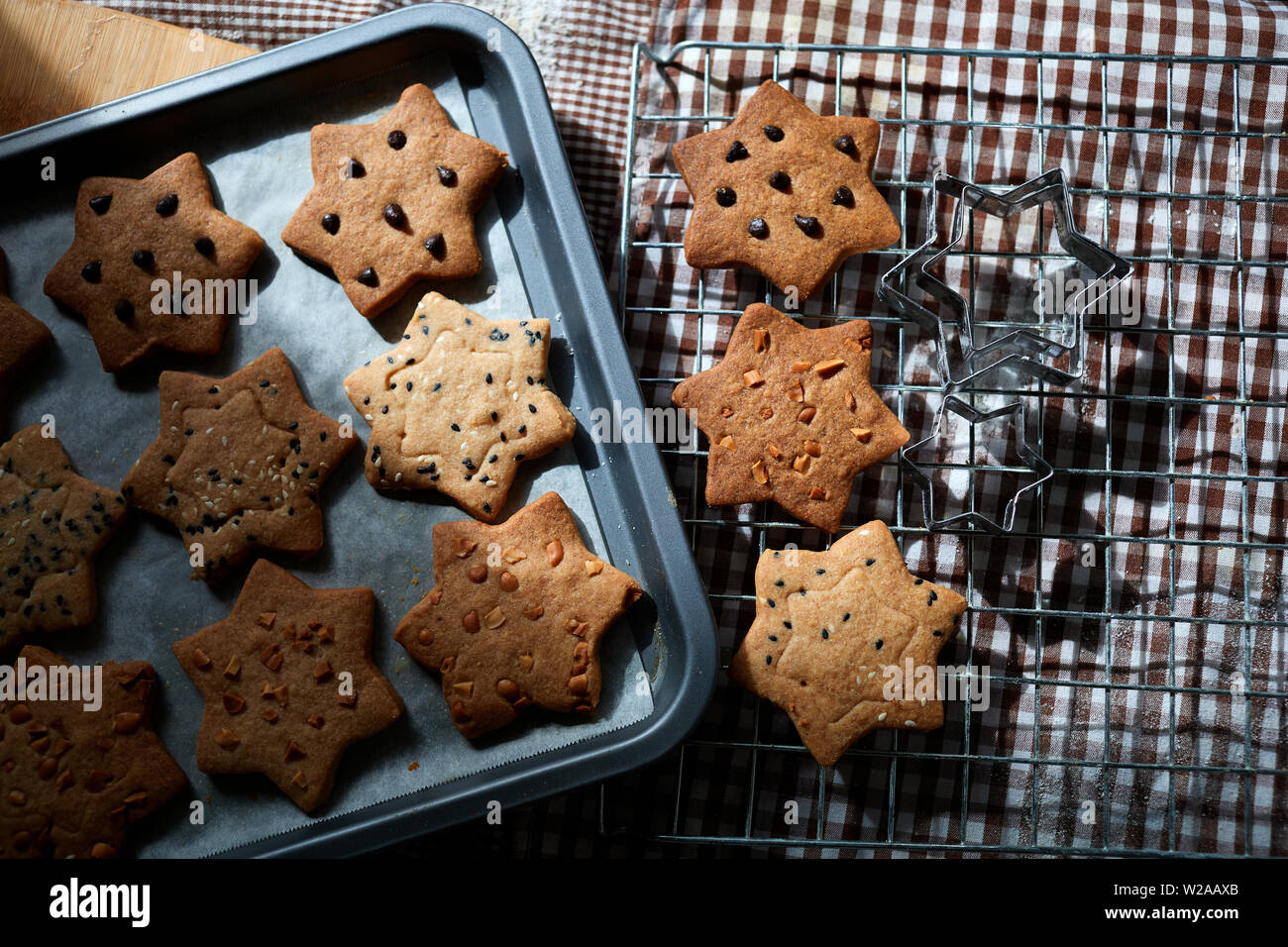Homemade star shape cookies on baking tray Stock Photo - Alamy