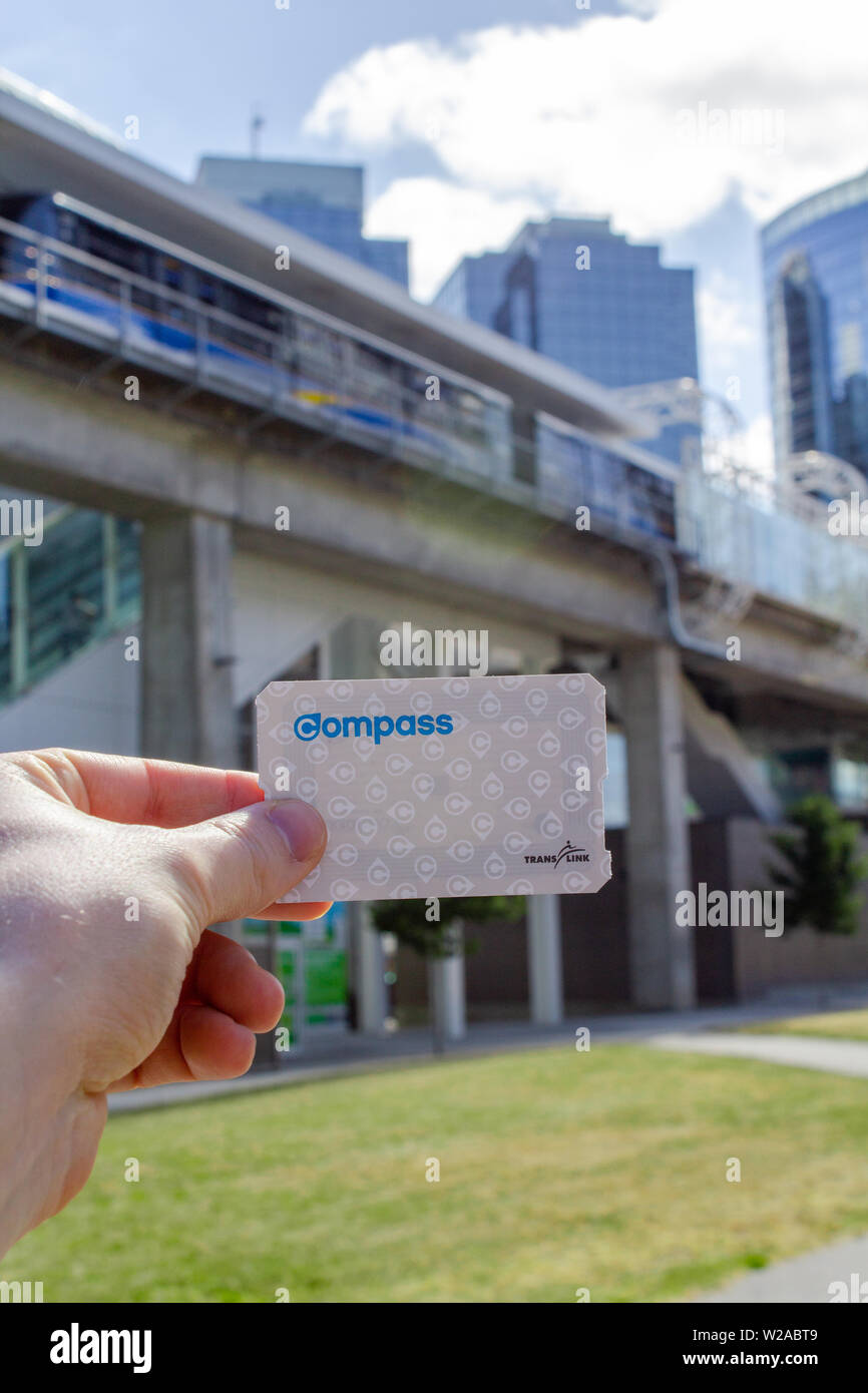 Hand holding a Translink Compass Card Stock Photo - Alamy