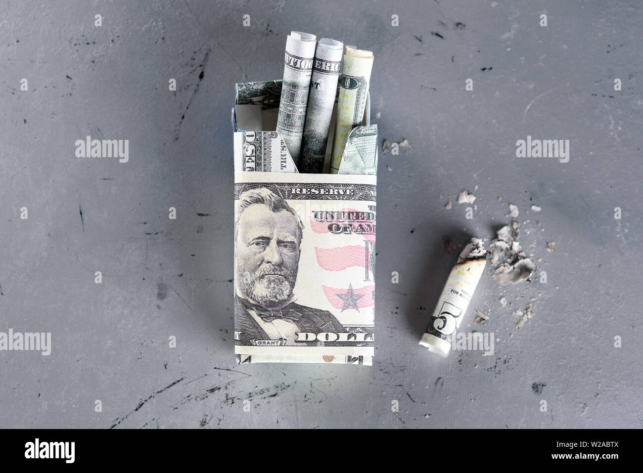 Package of cigarette filled with paper money dollars banknote instead ...