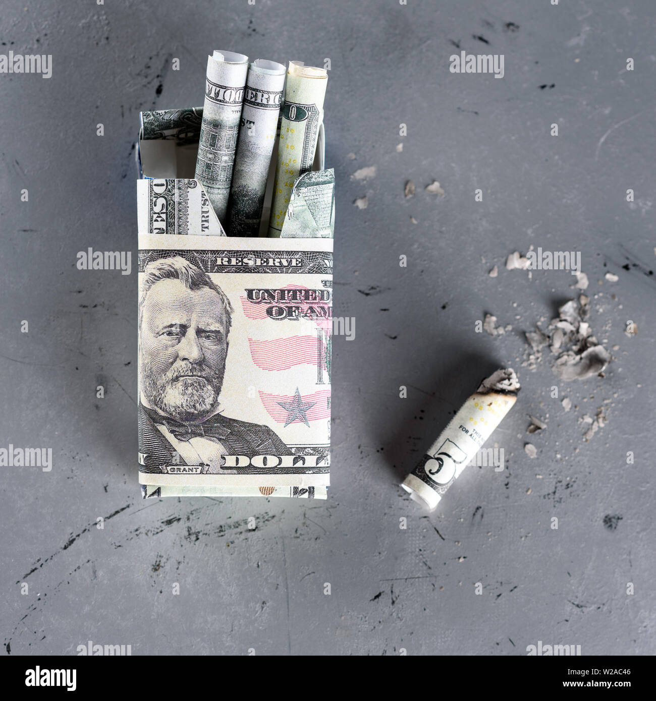 Package of cigarette filled with paper money dollars banknote and ...