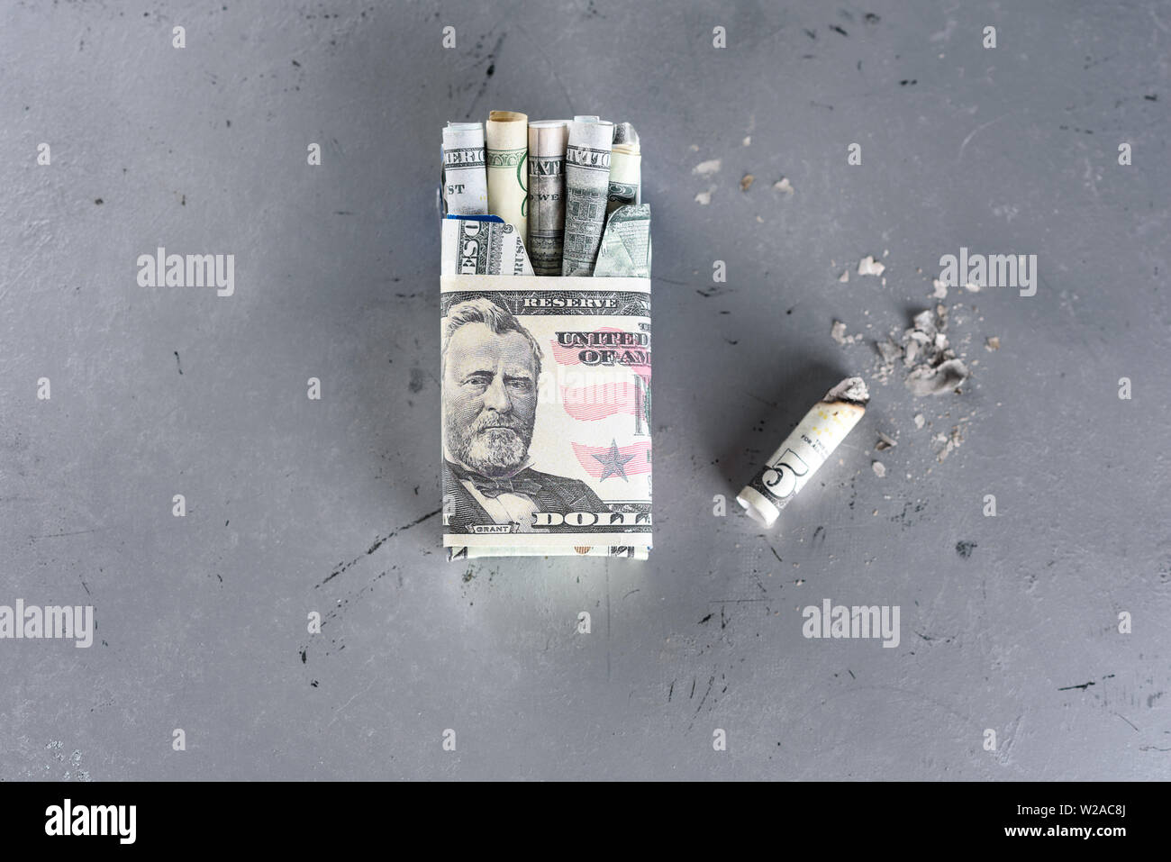 Package of cigarette filled with paper money dollars banknote and ...