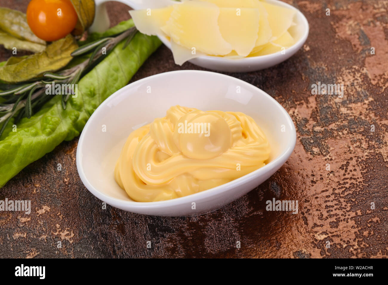 Cheese sauce in the bowl served sliced parmesan Stock Photo - Alamy