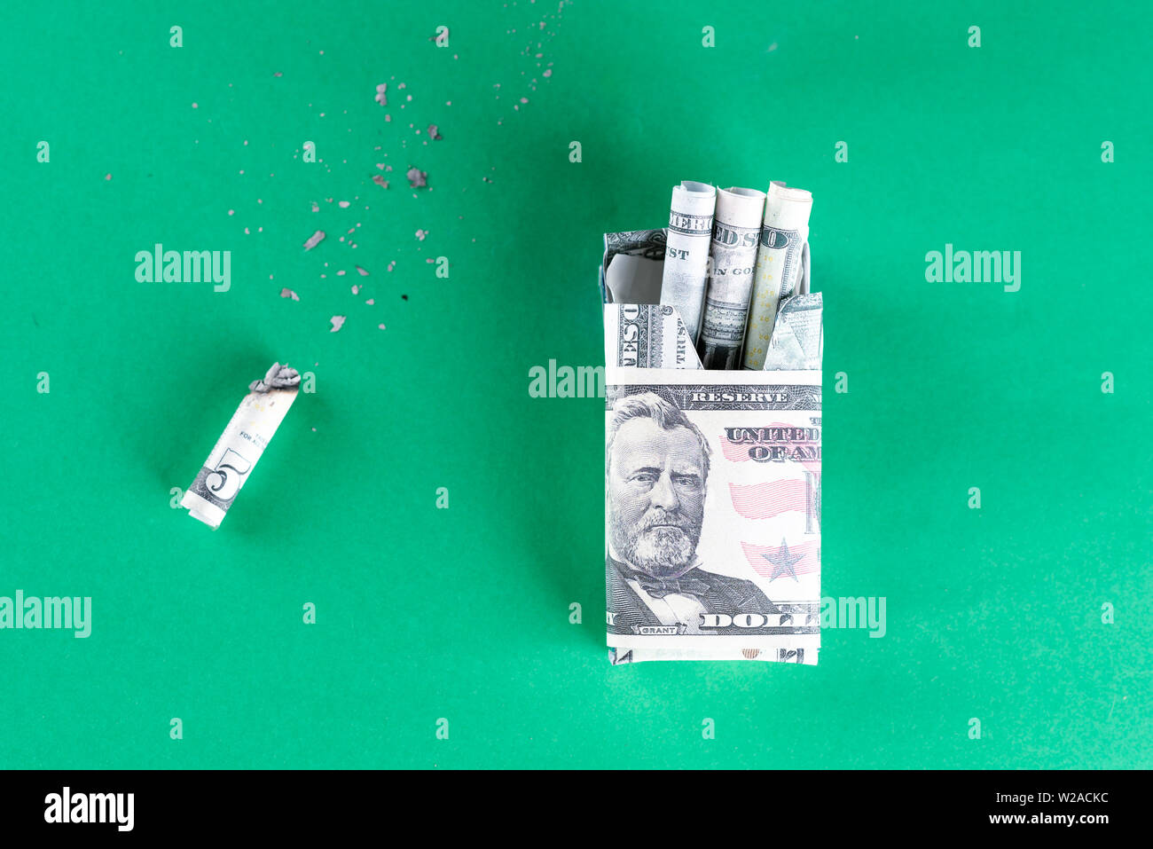 Package of cigarette filled with paper money dollars banknote and ...