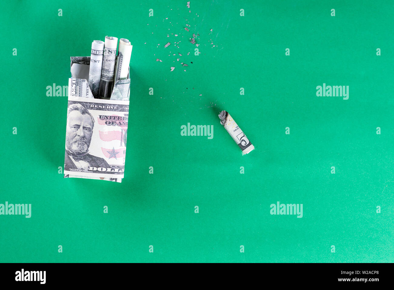 Package of cigarette filled with paper money dollars banknote and ...