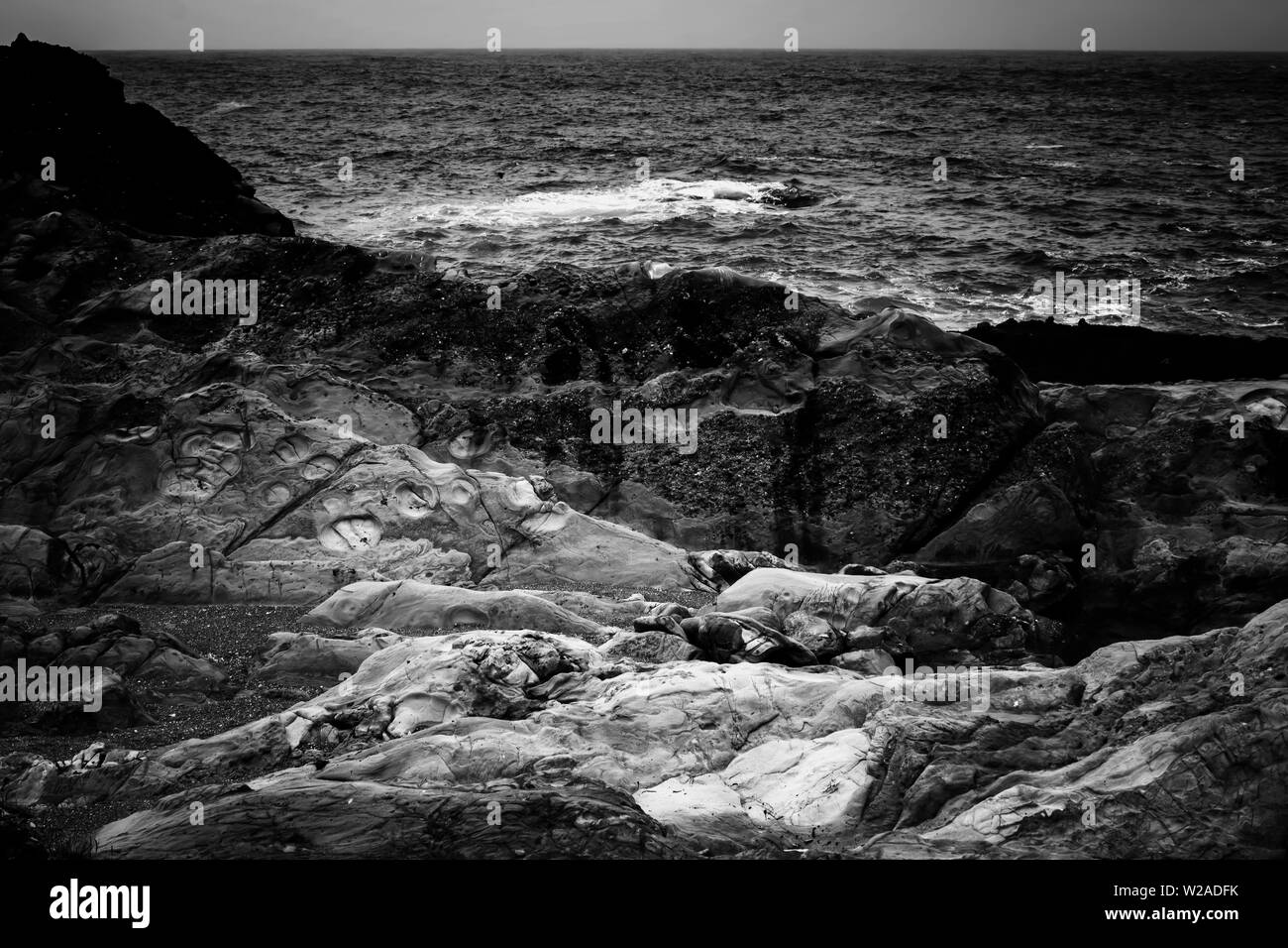 Black and white dramatic rock formations on California coast Stock ...